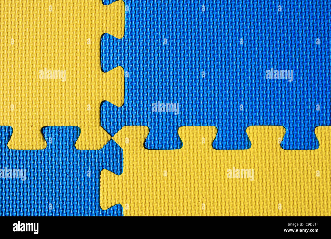 interlinked blue and yellow padded child play mats background Stock ...