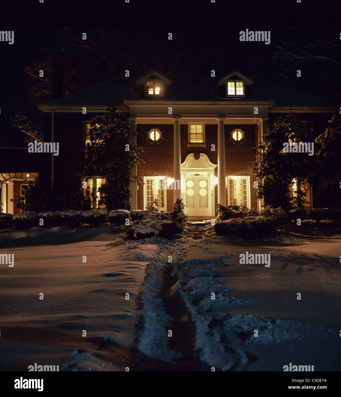 House lit up at night Stock Photo - Alamy
