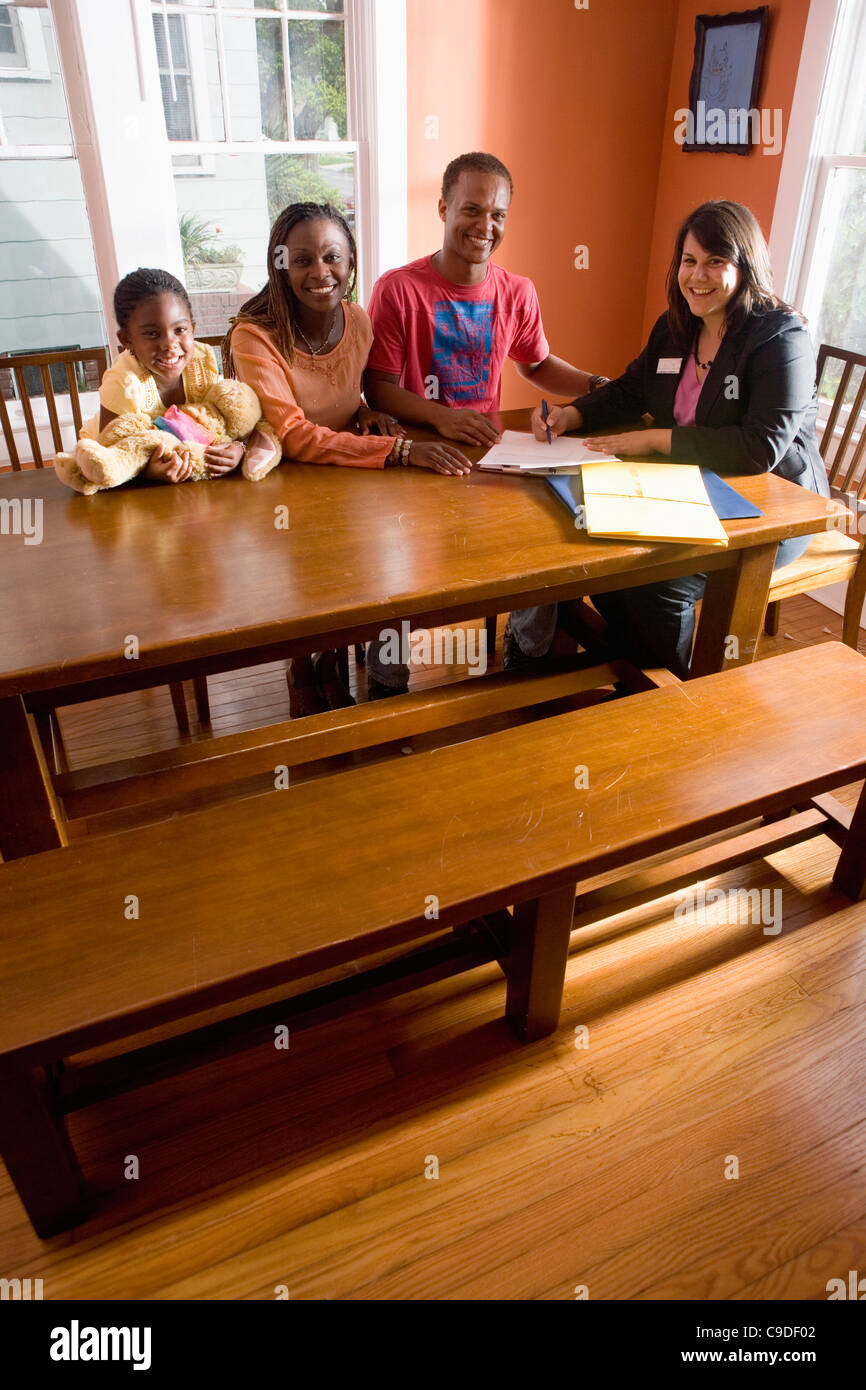 Portrait of family looking at documents hi-res stock photography and ...