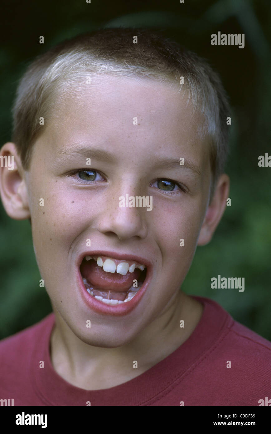Portrait of a boy yelling Stock Photo - Alamy