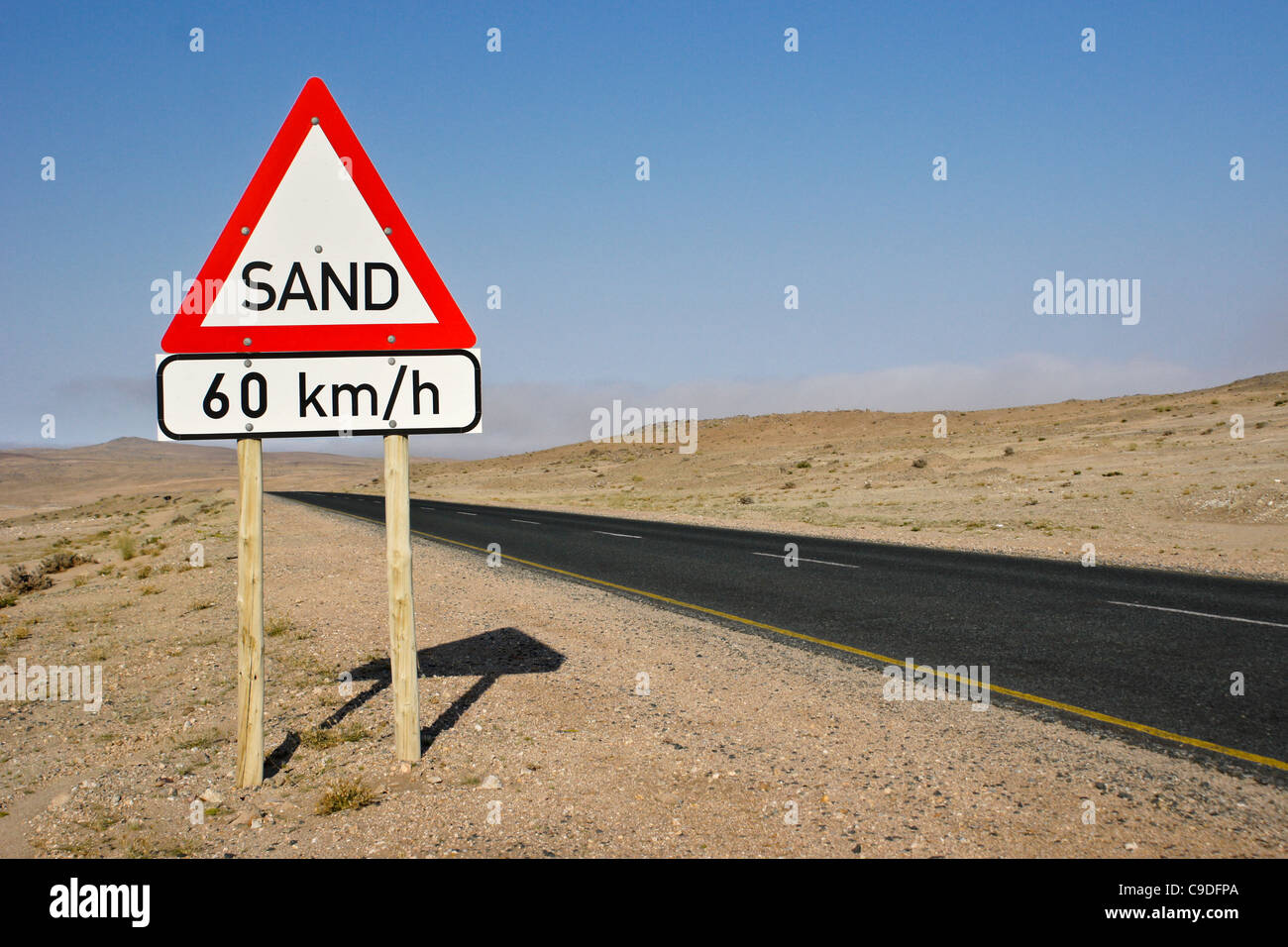 Warning sign on highway, Namibia Stock Photo - Alamy