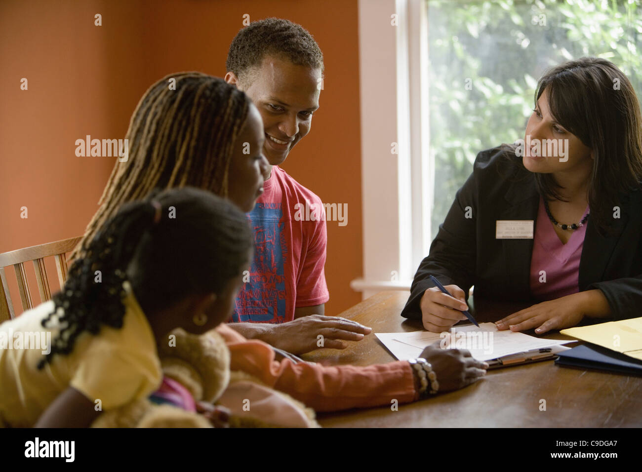 Father signing contract hi-res stock photography and images - Alamy