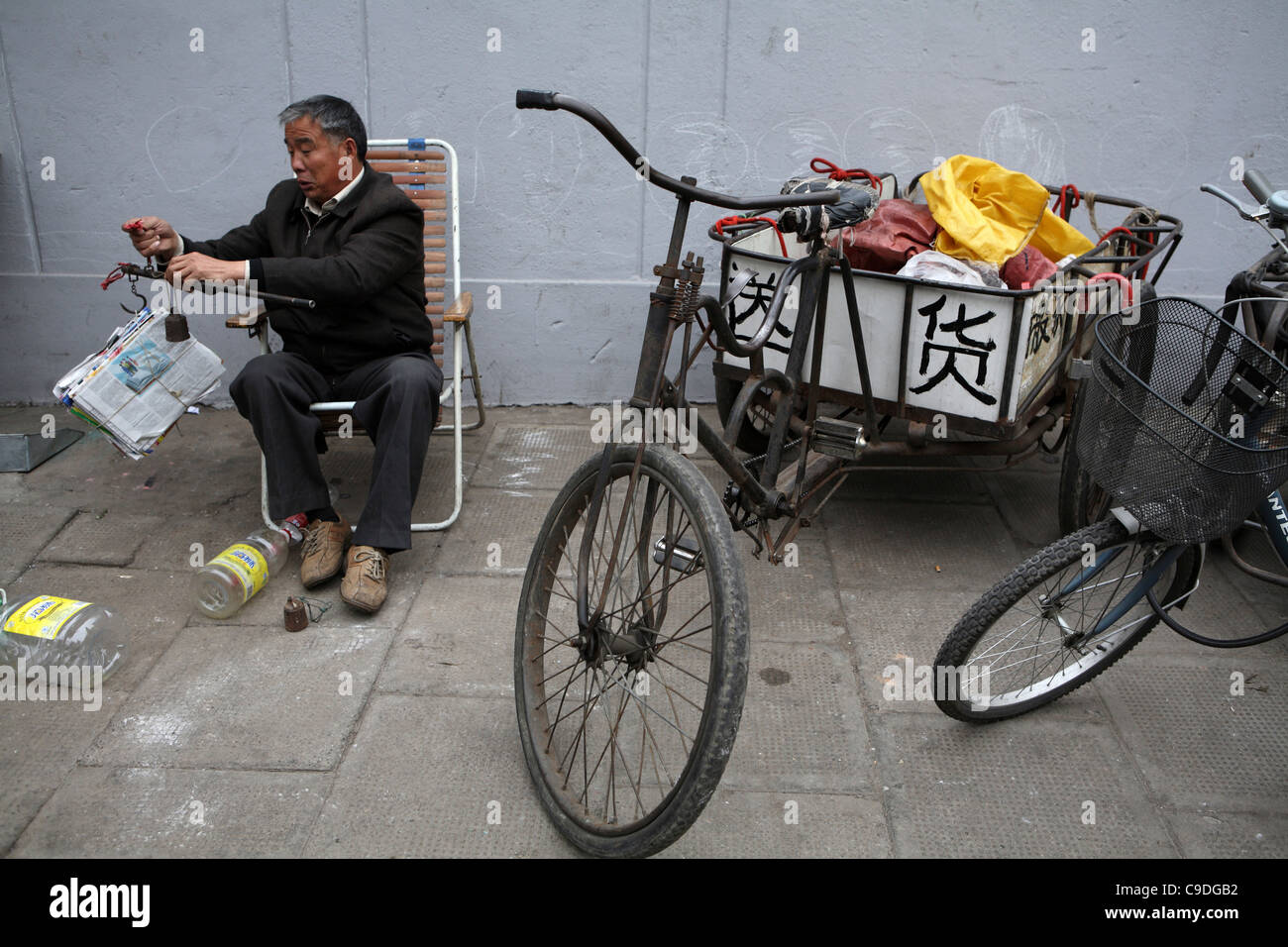 On street recycling, Shanghai, China, Asia, trader weighs paper and ...