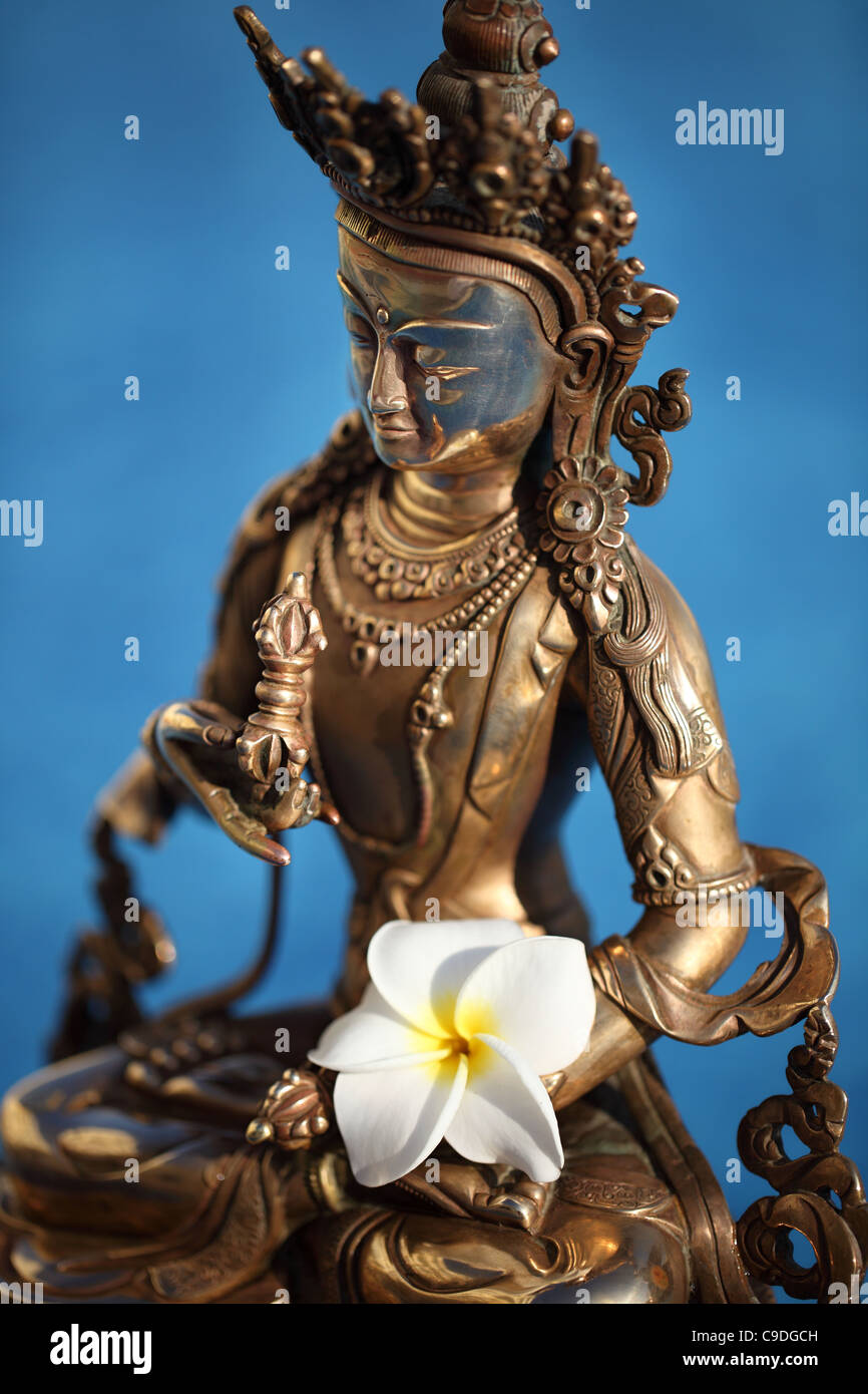 Buddha Vajrasattva holds the vajra in his right hand and a bell in his ...