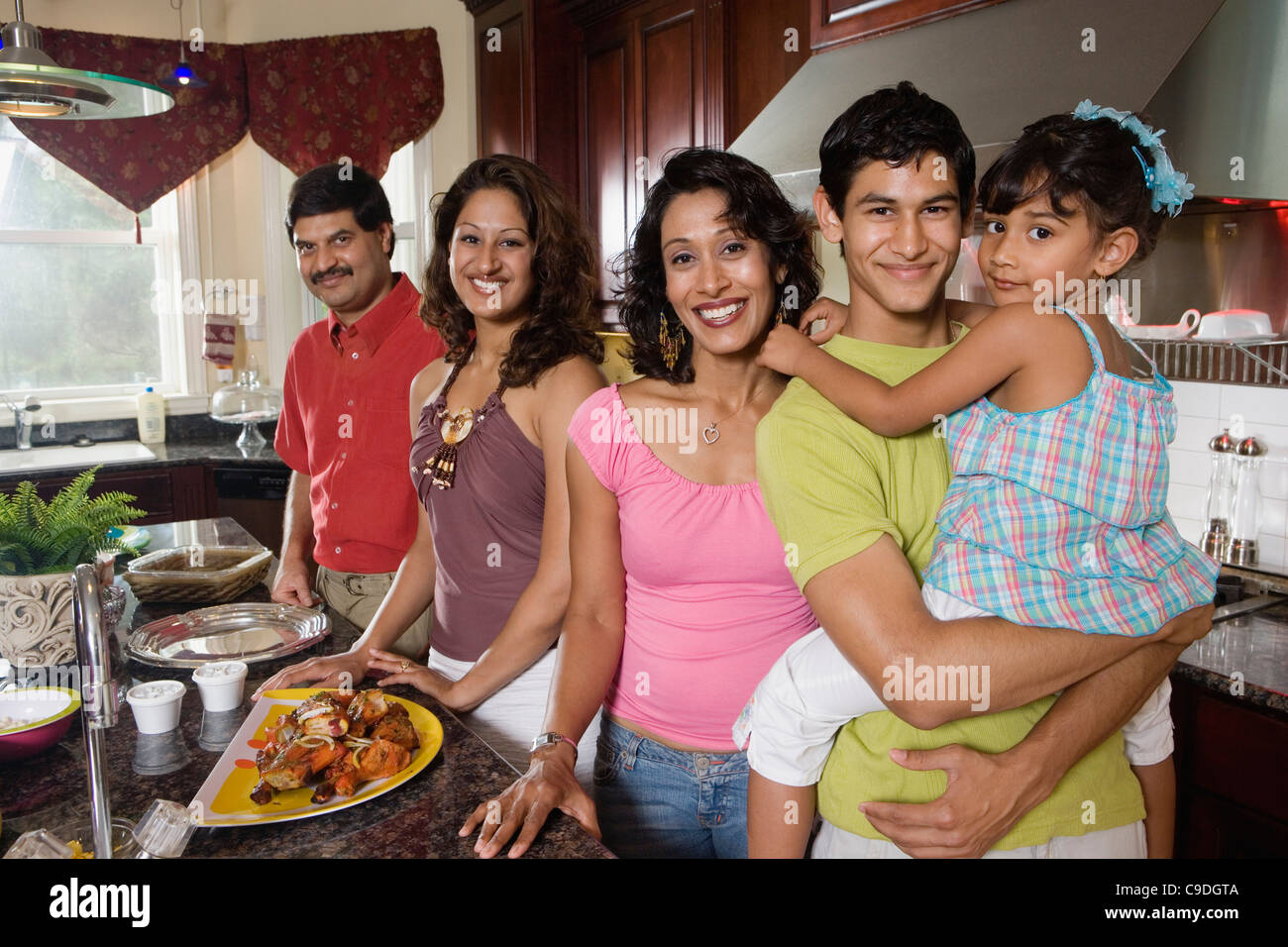 Portrait of extended Indian family in kitchen Stock Photo - Alamy