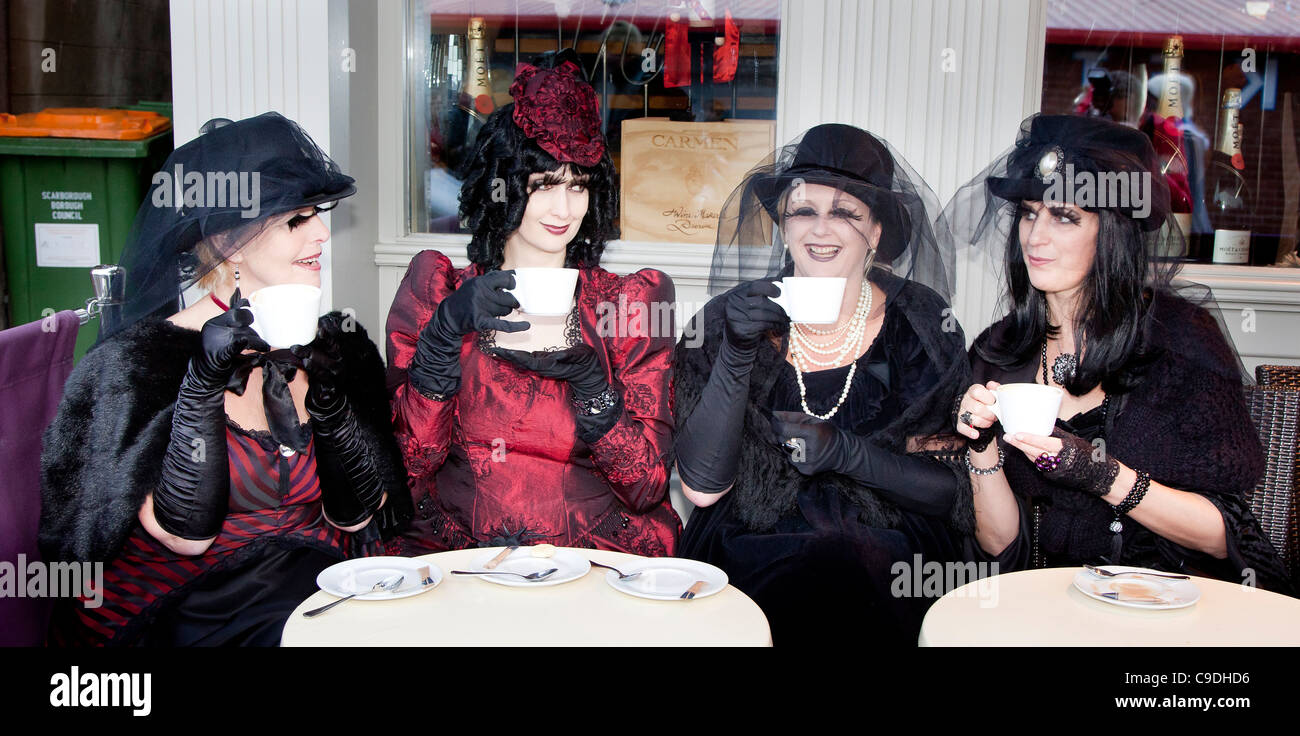 Four Goth ladies having tea at the Whitby Goth Festival, North ...