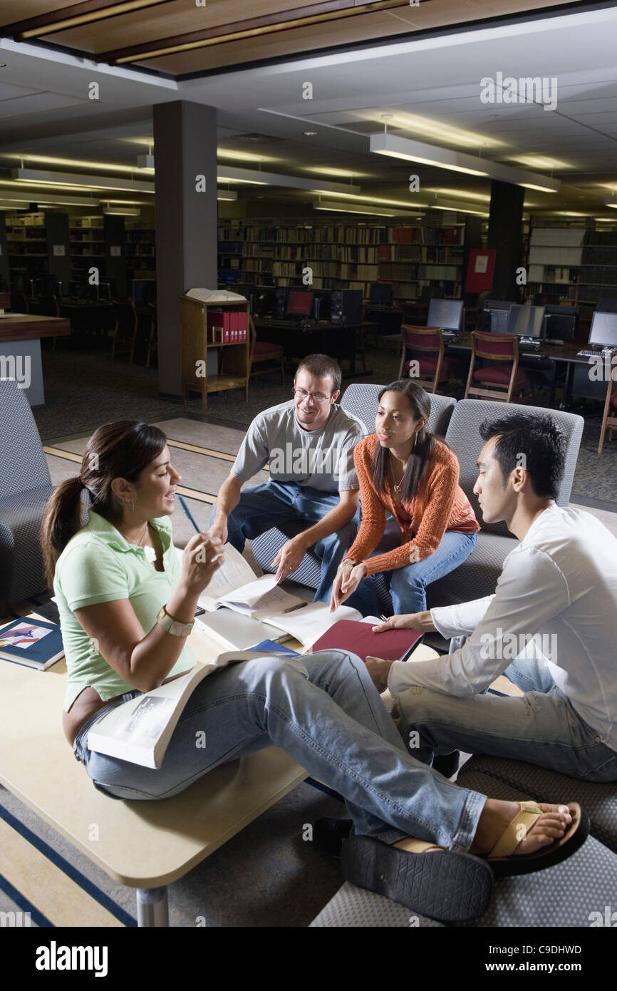 Students in library sitting on sofas studying Stock Photo - Alamy