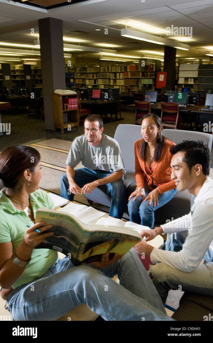 Students in library sitting on sofas studying Stock Photo - Alamy