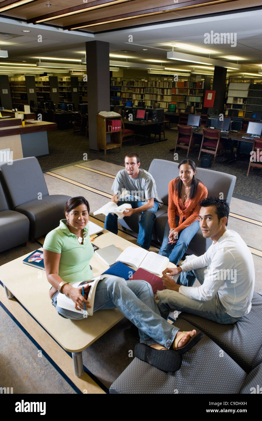Students in library sitting on sofas studying Stock Photo - Alamy