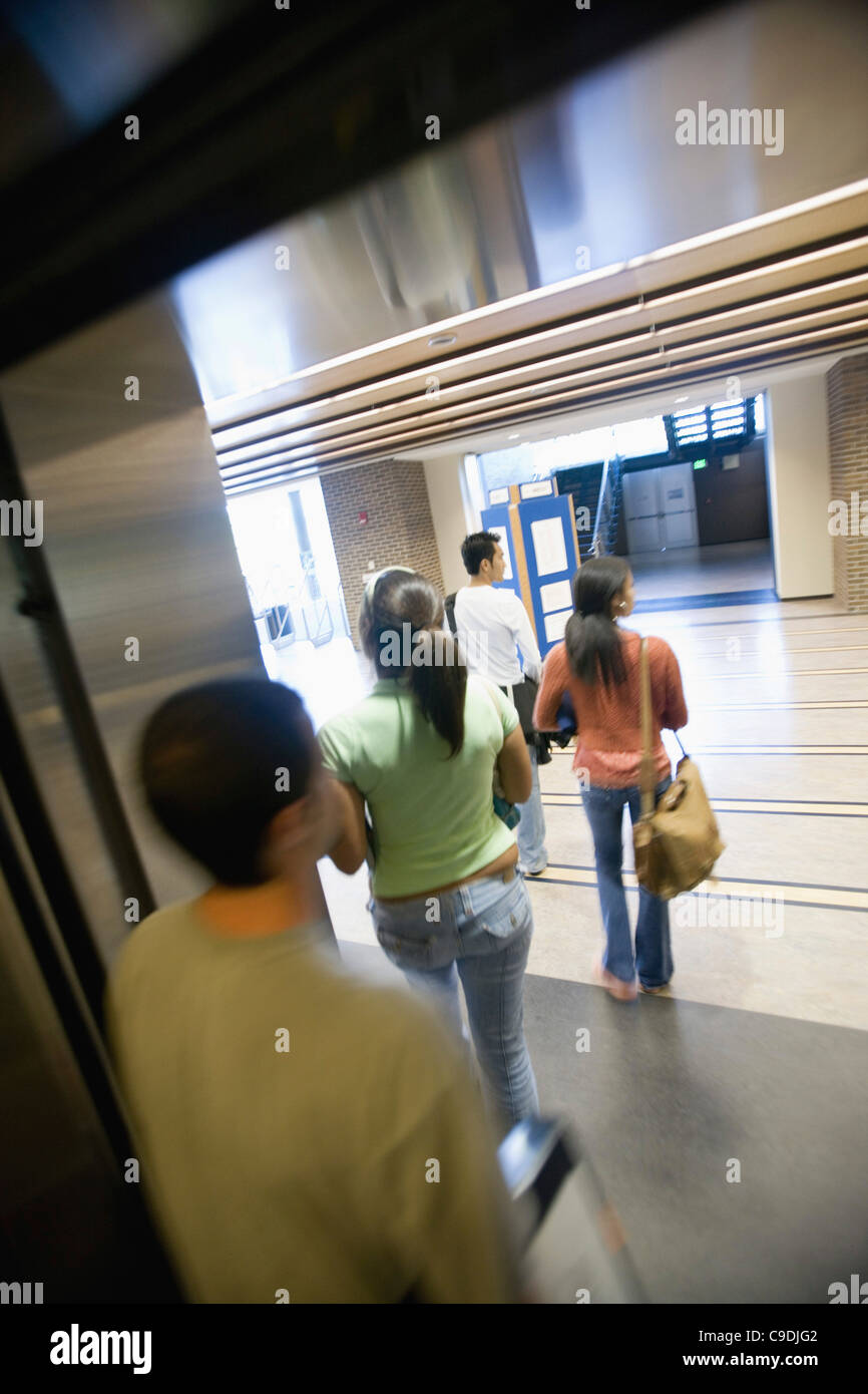 Students exiting an elevator Stock Photo - Alamy