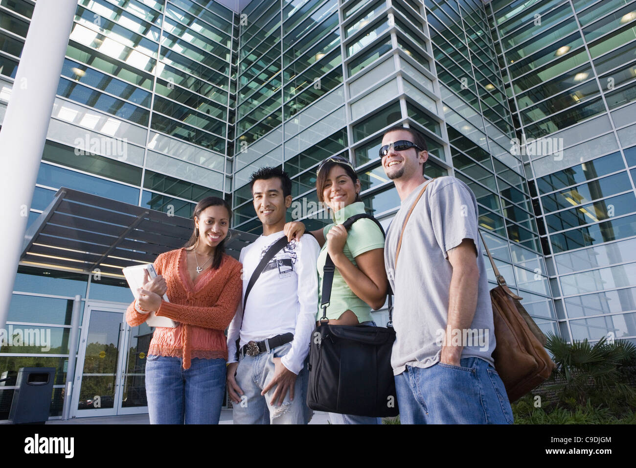 College students standing in front of a building Stock Photo - Alamy