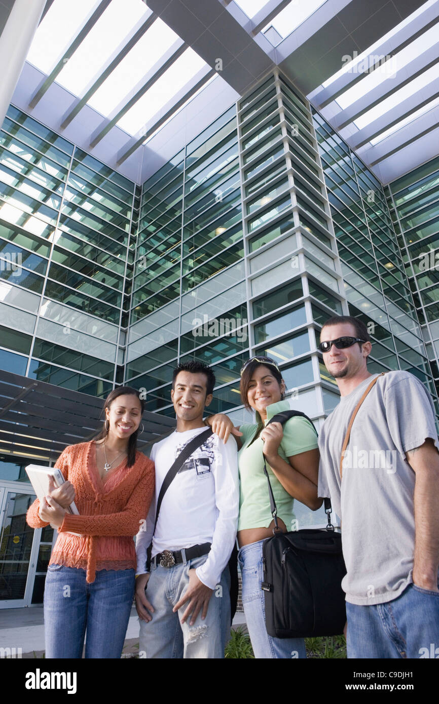 College students standing in front of a building Stock Photo - Alamy