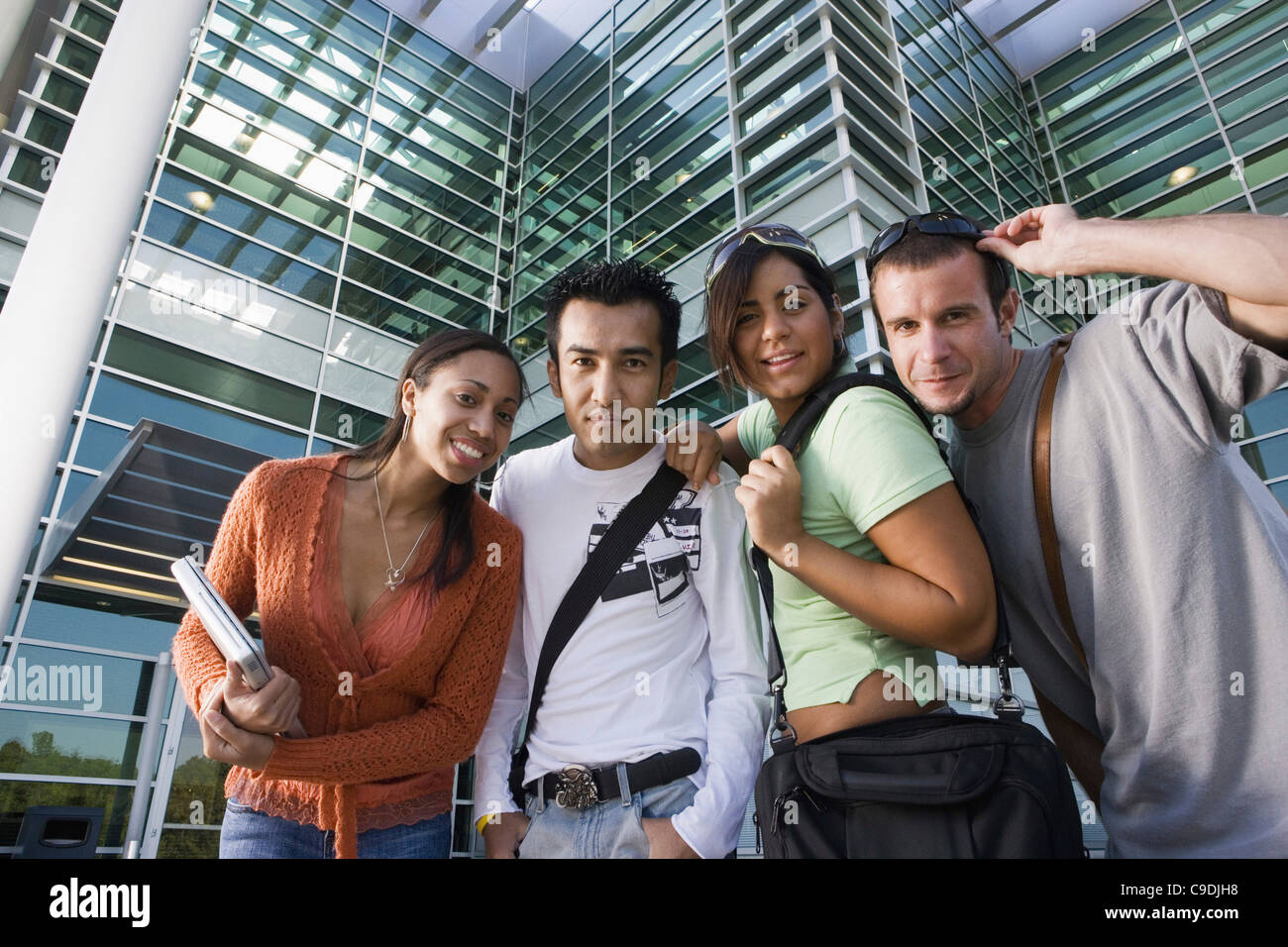 College students standing in front of a building Stock Photo - Alamy