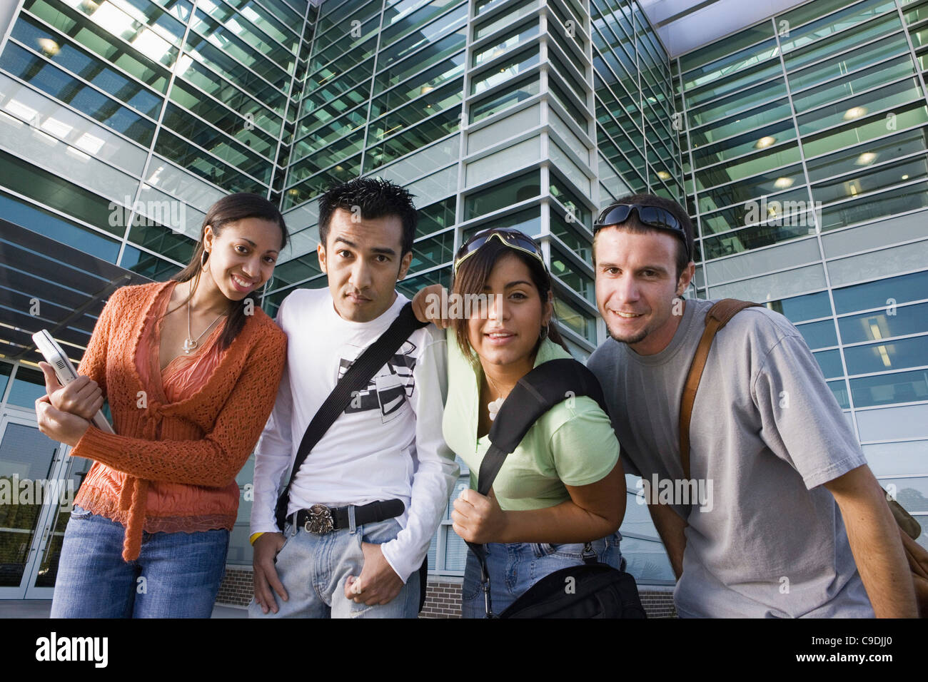 College students standing in front of a building Stock Photo - Alamy
