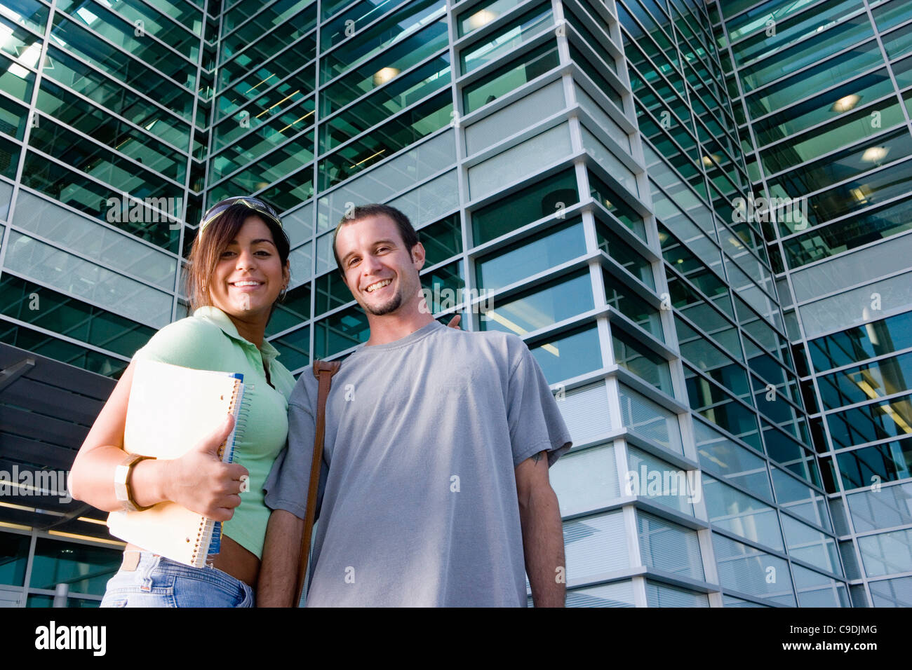 University students standing outside campus building Stock Photo - Alamy