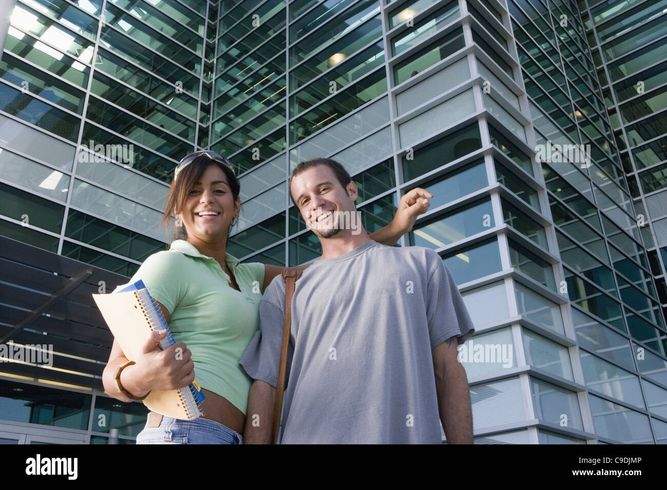 University students standing outside campus building Stock Photo - Alamy