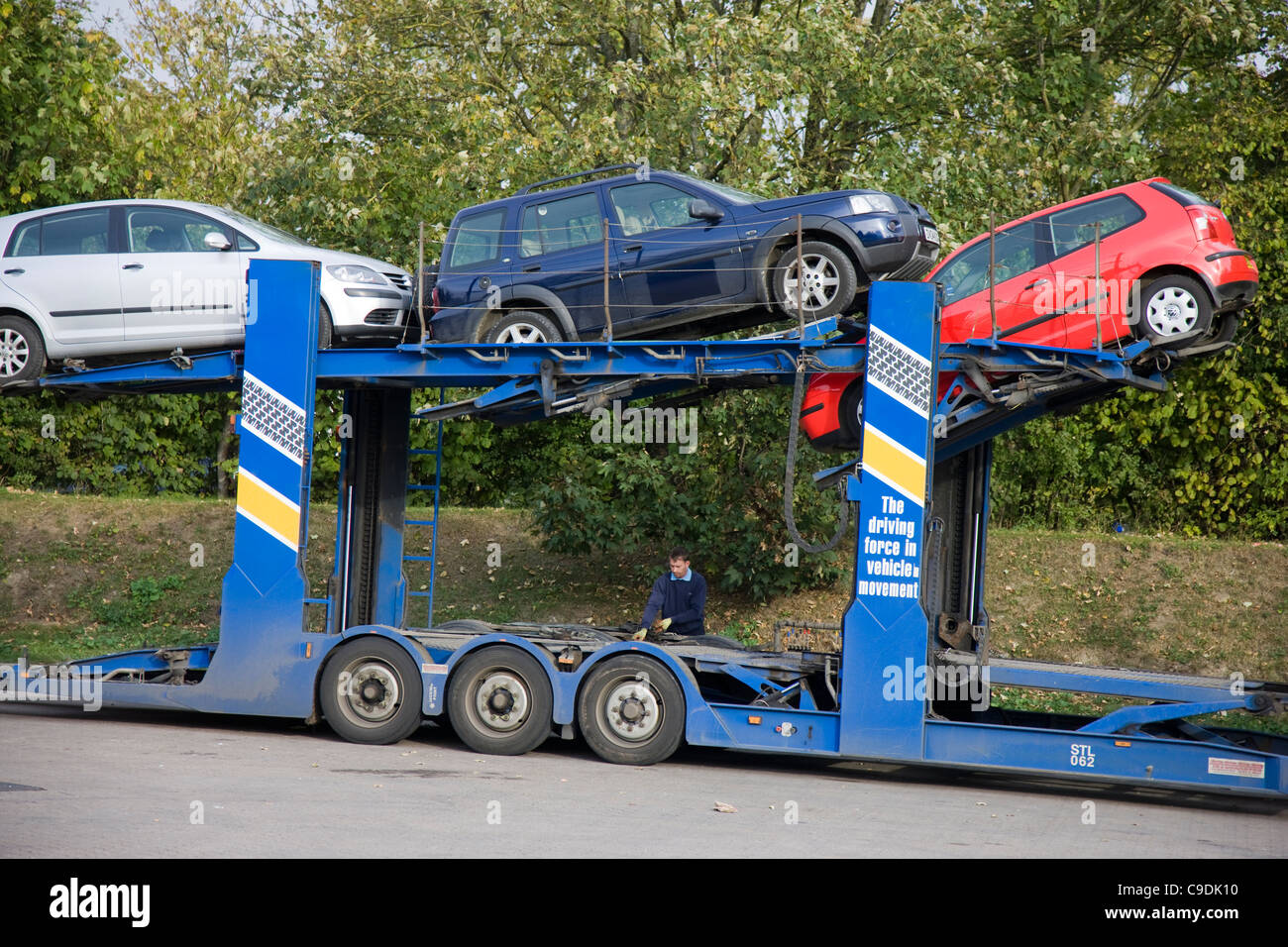 Loading vehicles onto a car transporter Stock Photo - Alamy