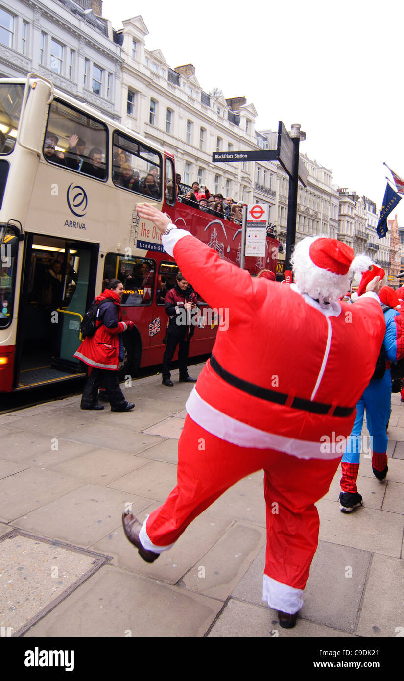 A man dressed as an inflatable Santa Claus takes part in "Santacon" in ...