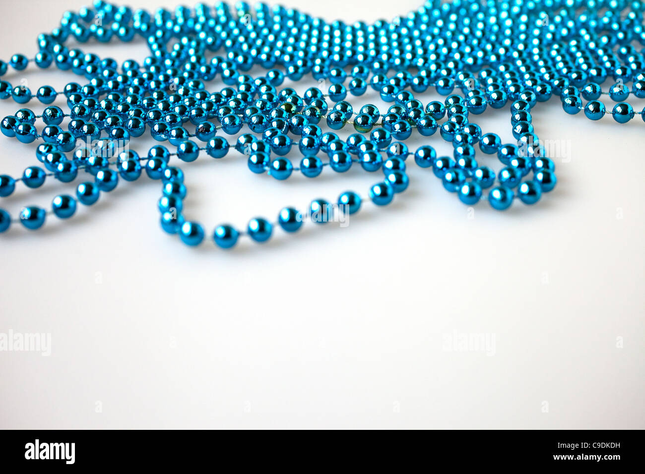 shining blue beads on white Stock Photo - Alamy