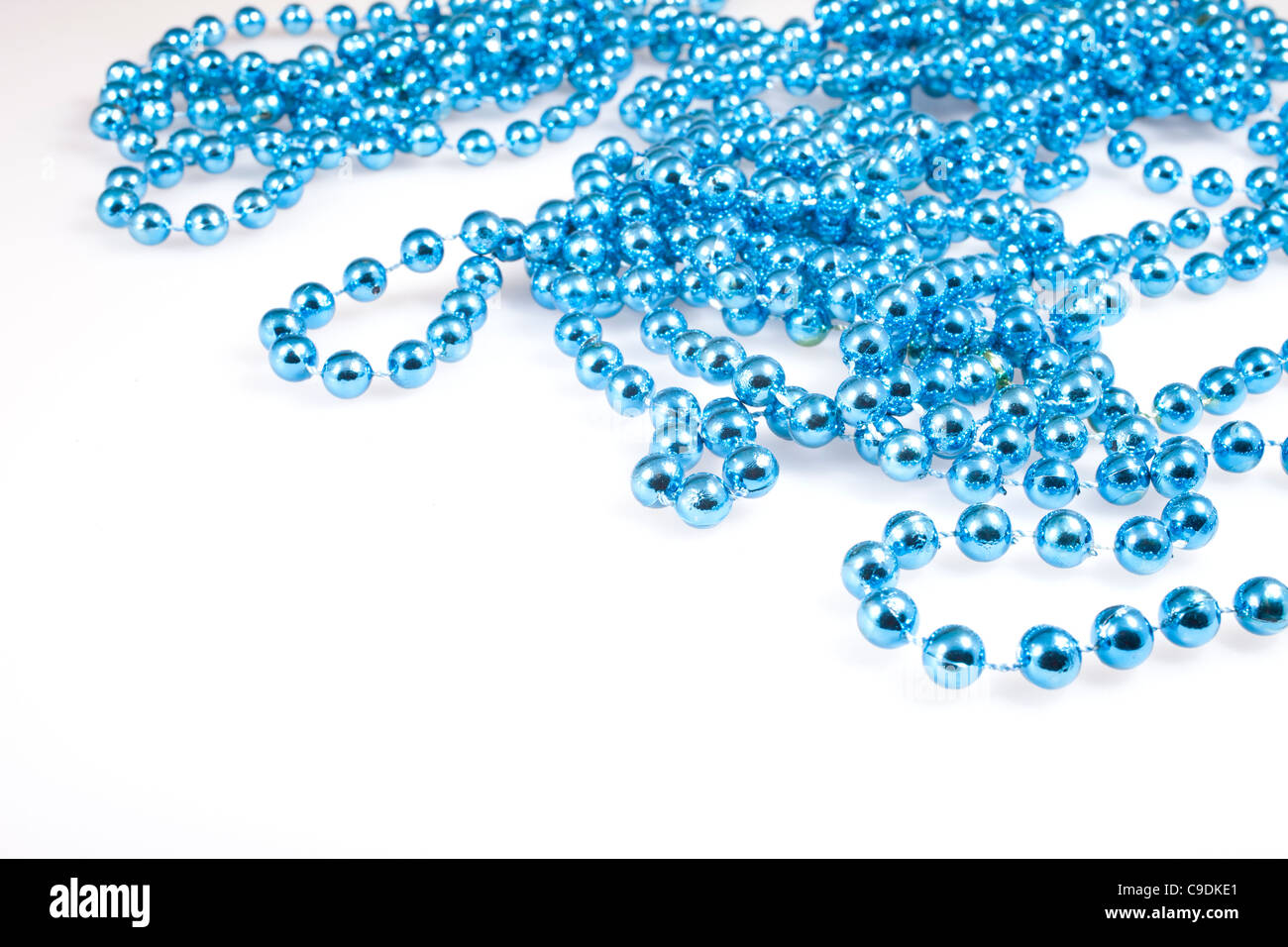 shining blue beads on white Stock Photo - Alamy