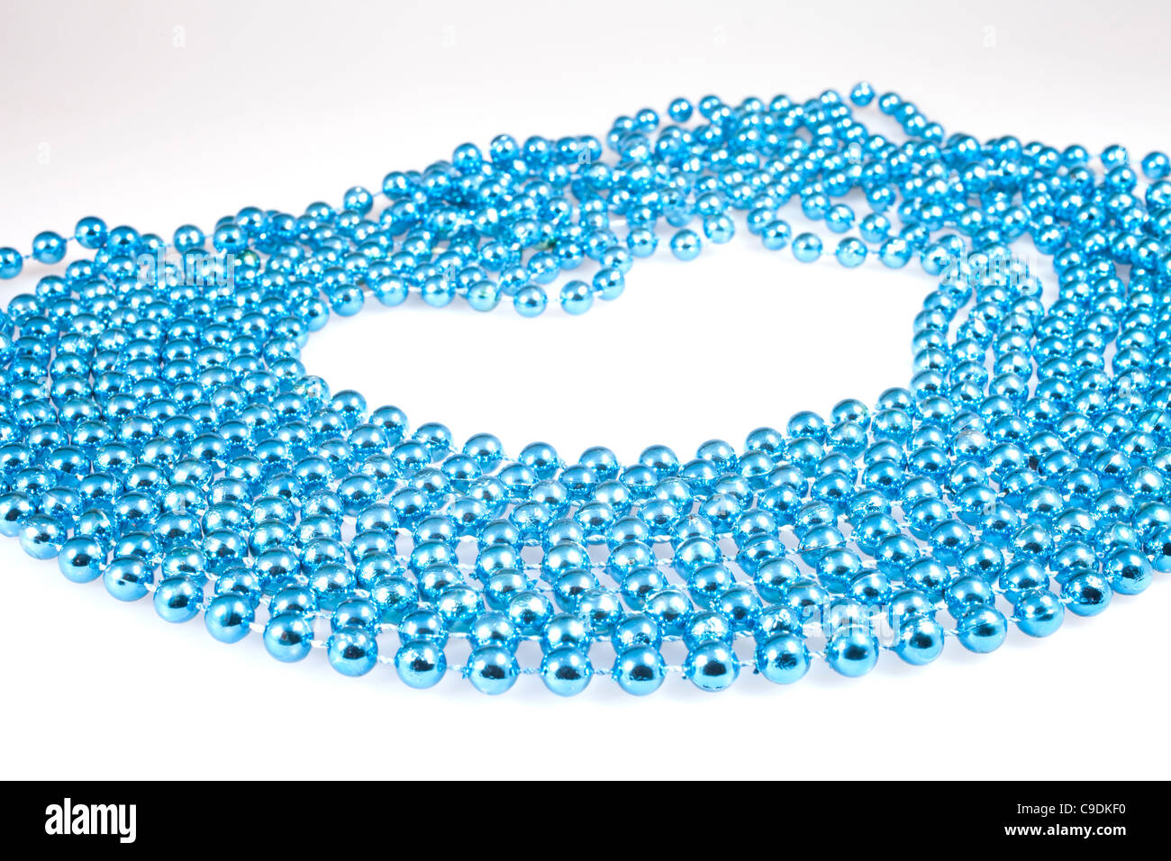shining blue beads on white Stock Photo - Alamy