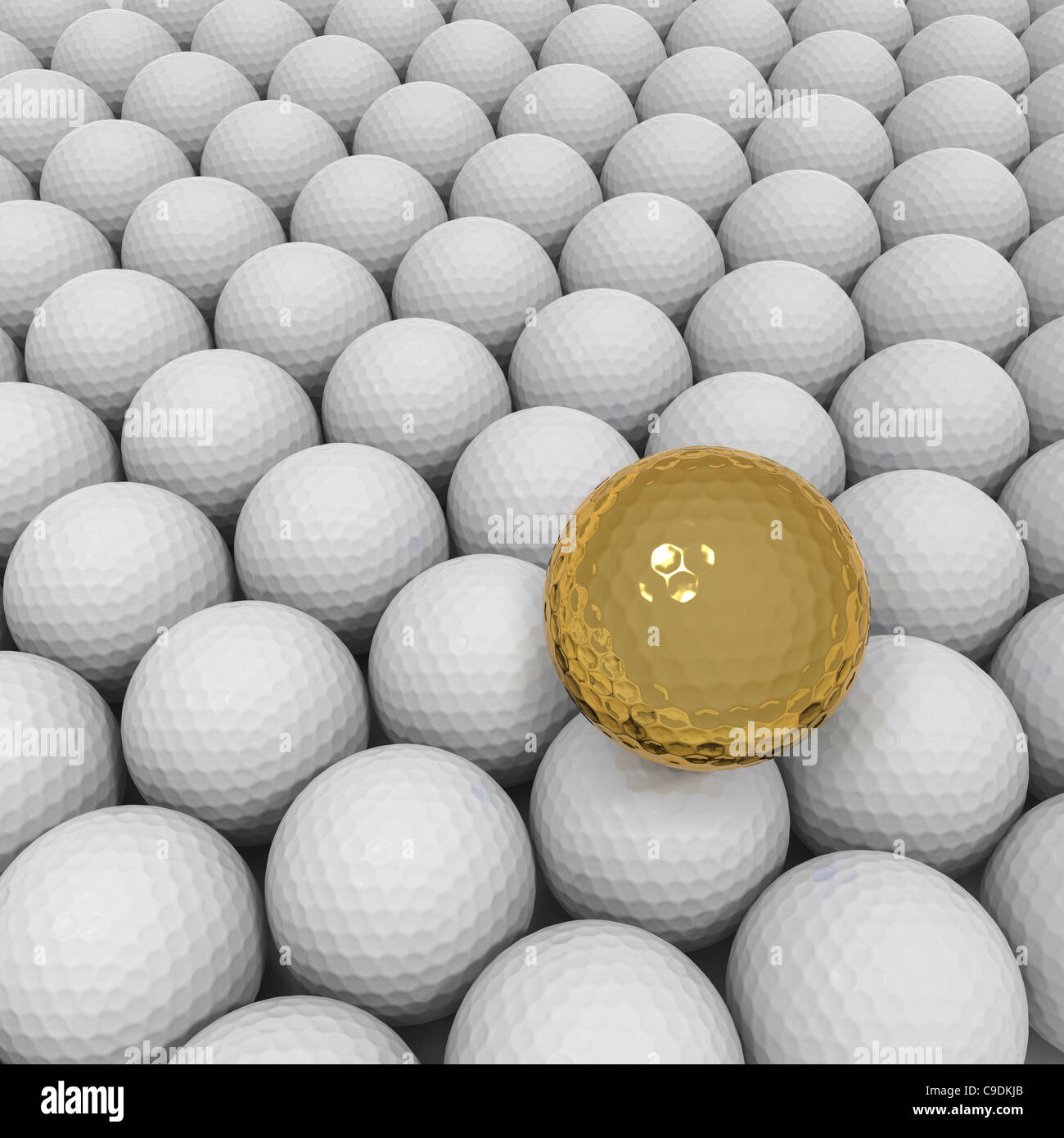 Larger than life golden golf ball on a background of many golf balls ...