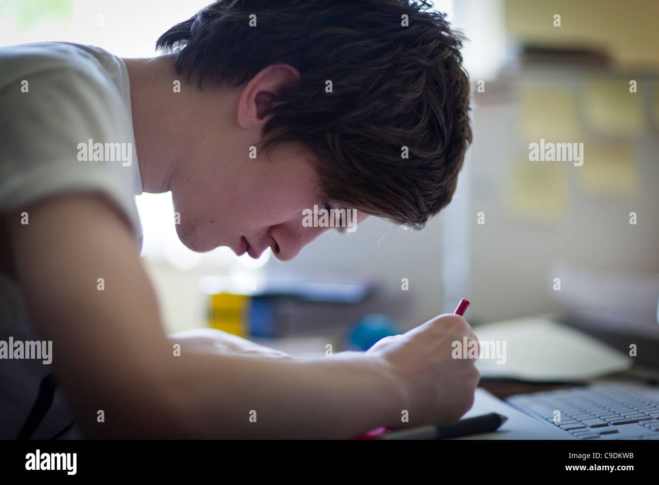 Close-up of teenage boy drawing with a pencil Stock Photo - Alamy