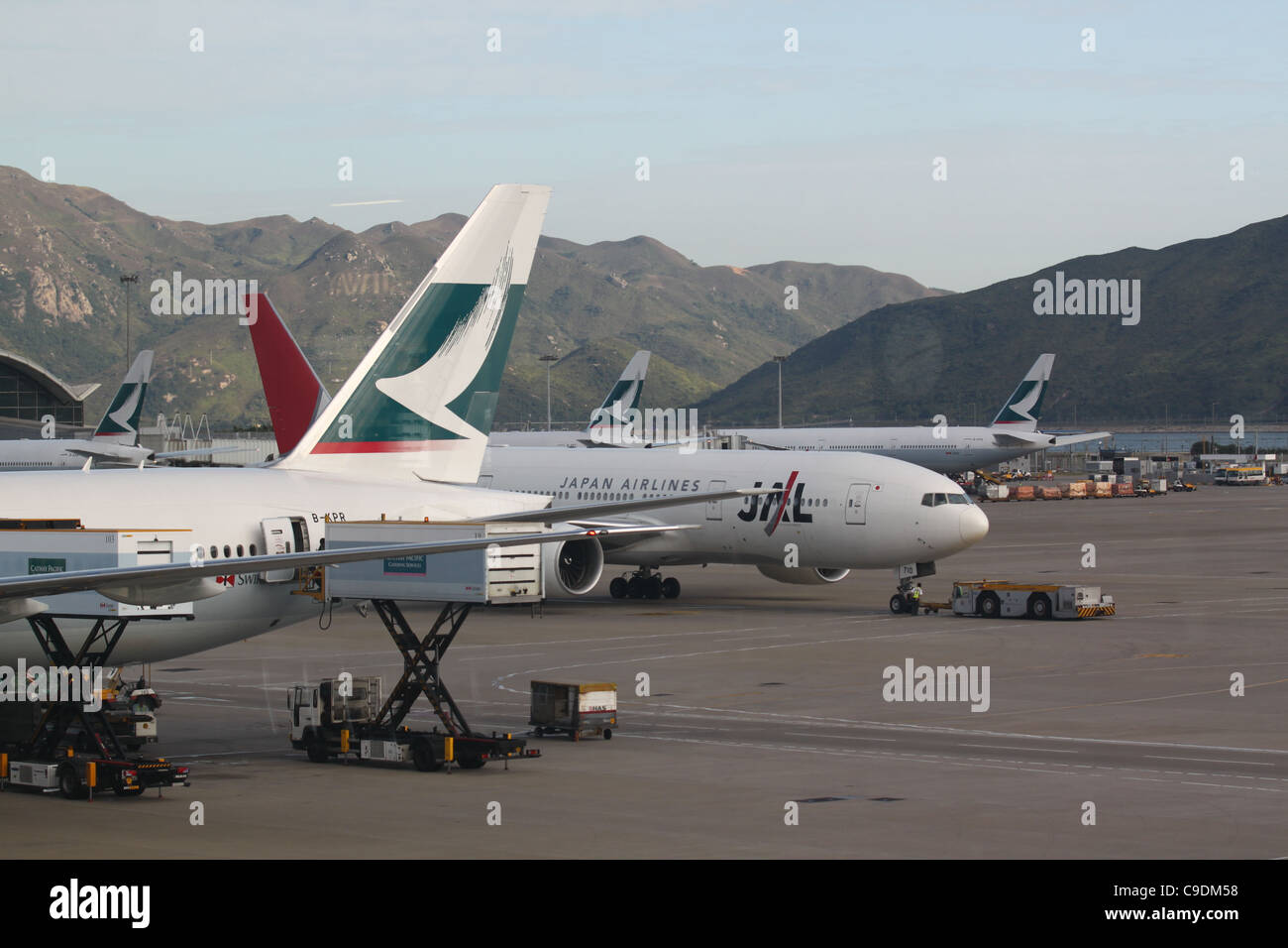 Parked airplanes getting ready for take-off Stock Photo - Alamy