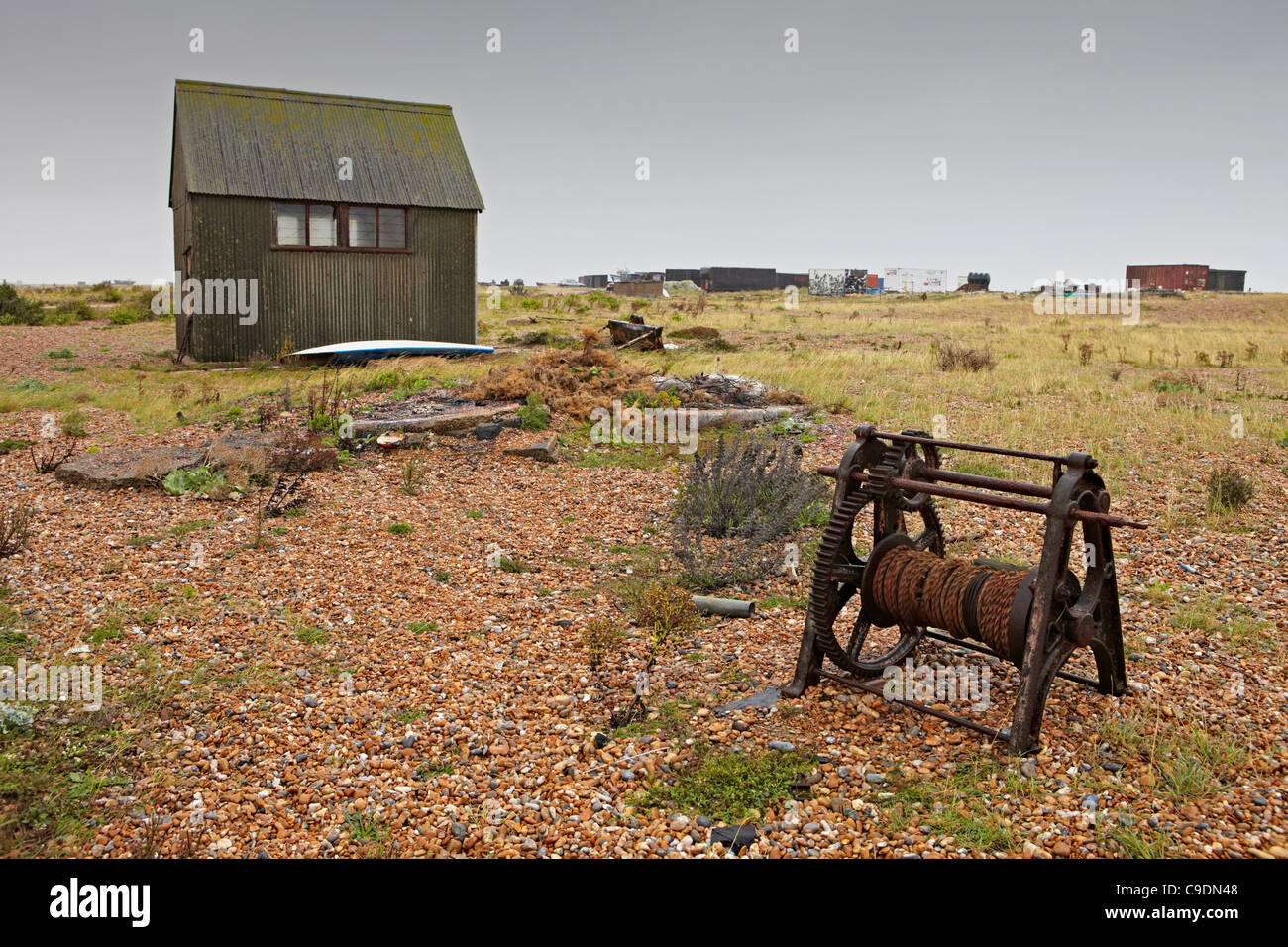 Dungeness beach with derelict buildings and equipment Stock Photo - Alamy
