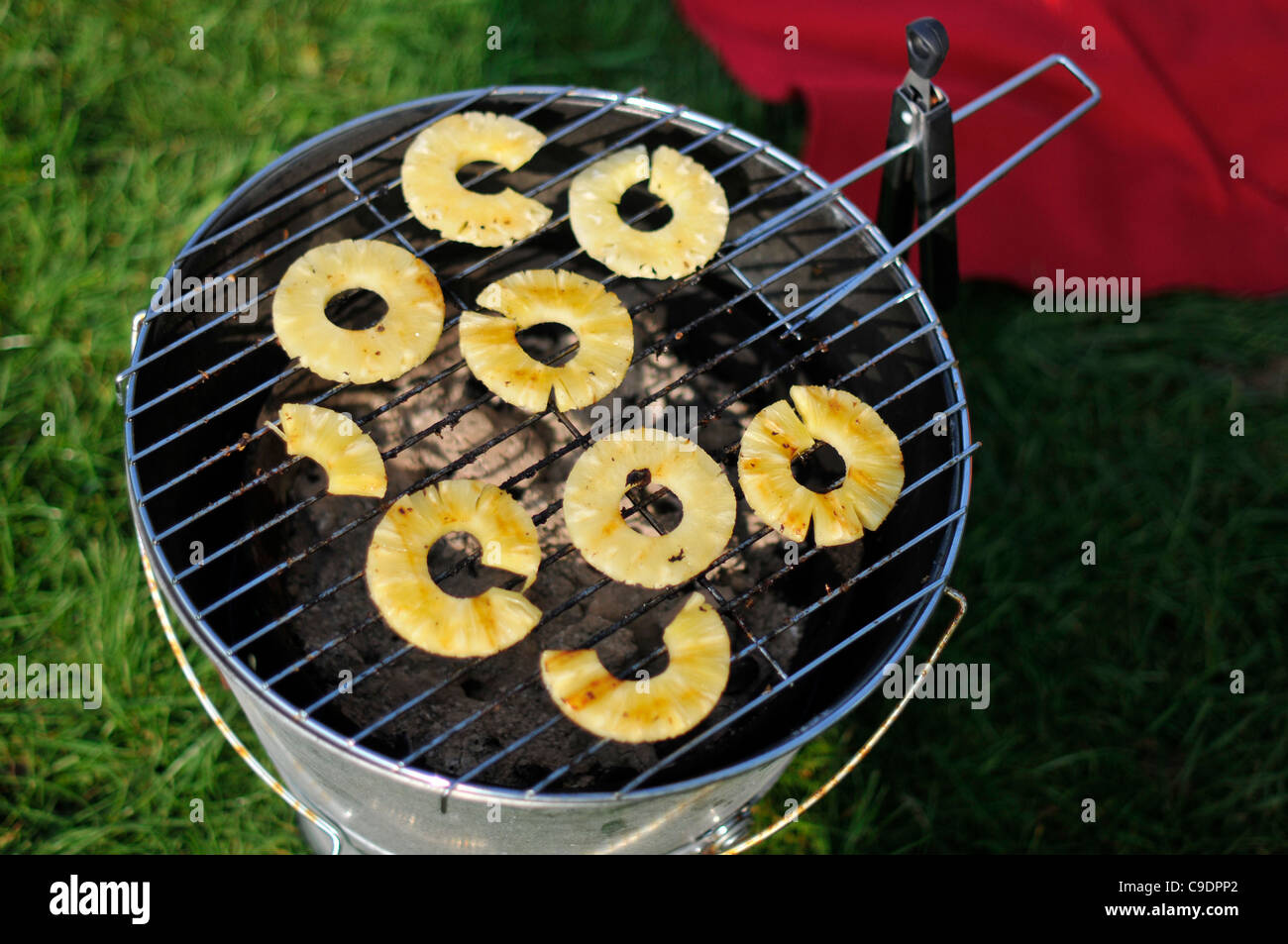Pineapple rings on a barbecue Stock Photo - Alamy