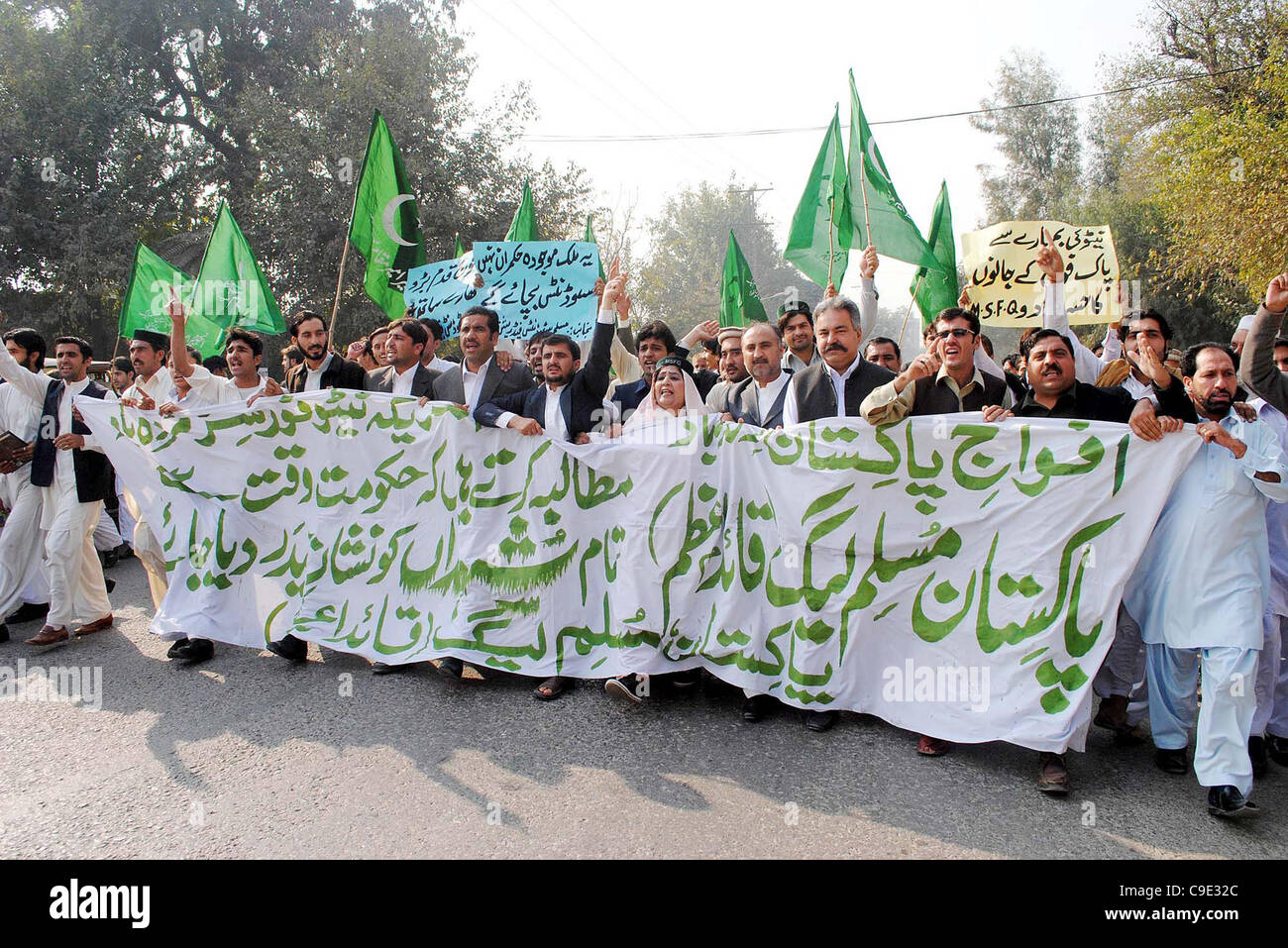 Supporters of Muslim League-Q shout slogans in favor of Pak Army during ...