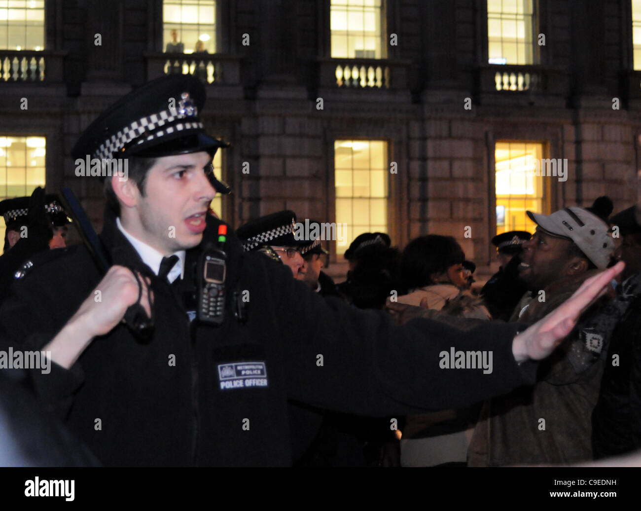 Police using batons hi-res stock photography and images - Alamy