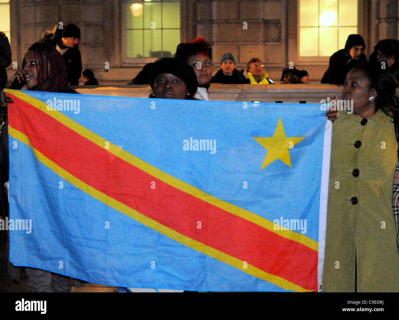 Congolese protesters holding a flag at White Hall. The protest was to ...