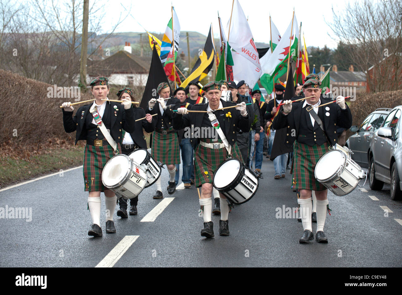 The Welsh National Drum Band lead the march to The Memorial Stone ...