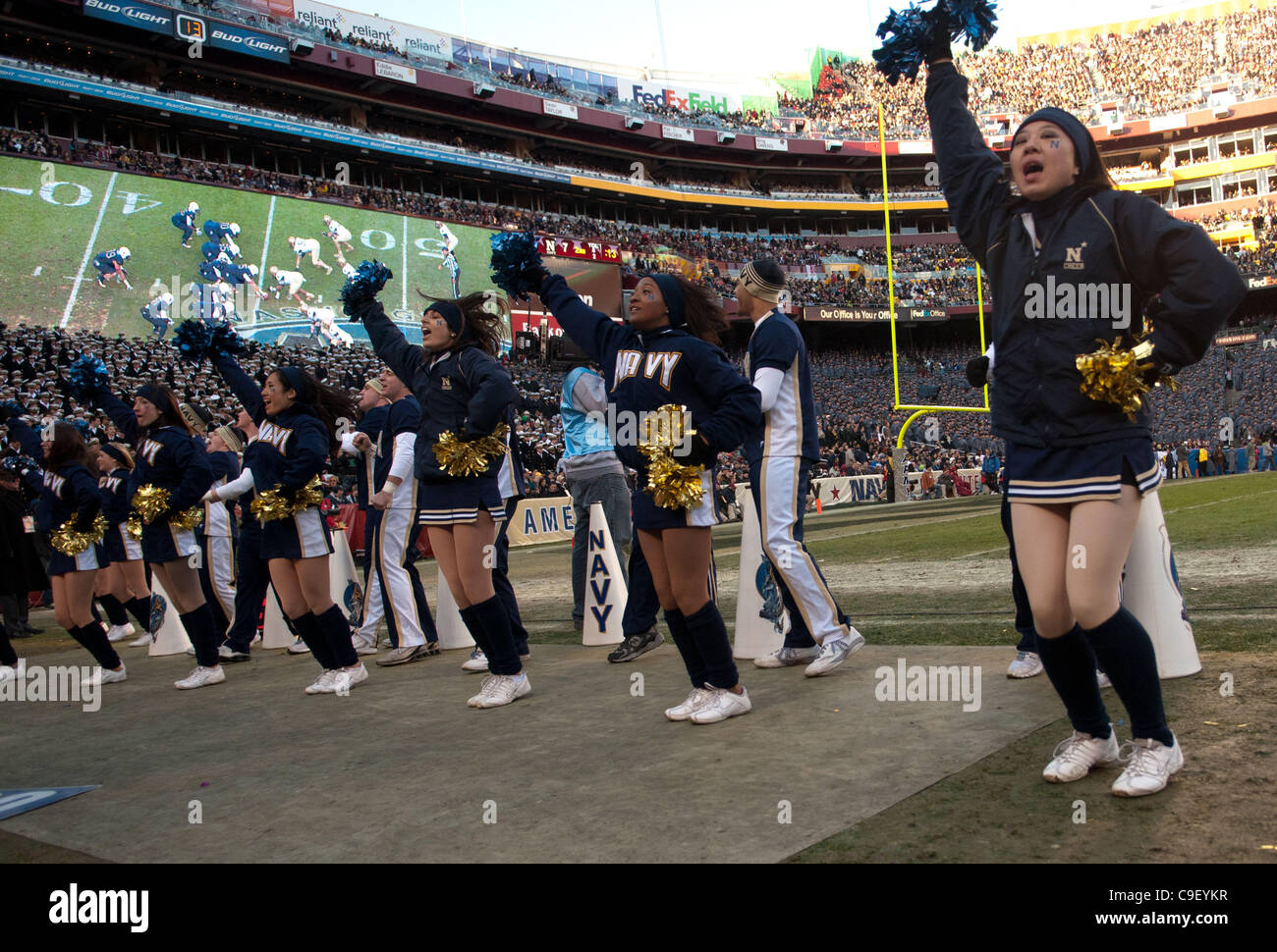 Navy cheerleaders work the crowd in the first half of the Army-Navy ...