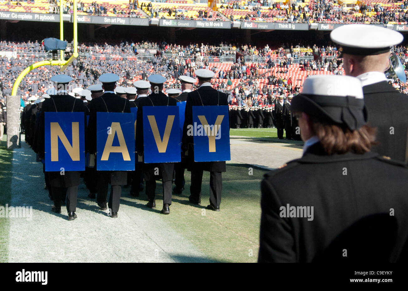 Cadets from the United States Naval Academy march on to the field at ...