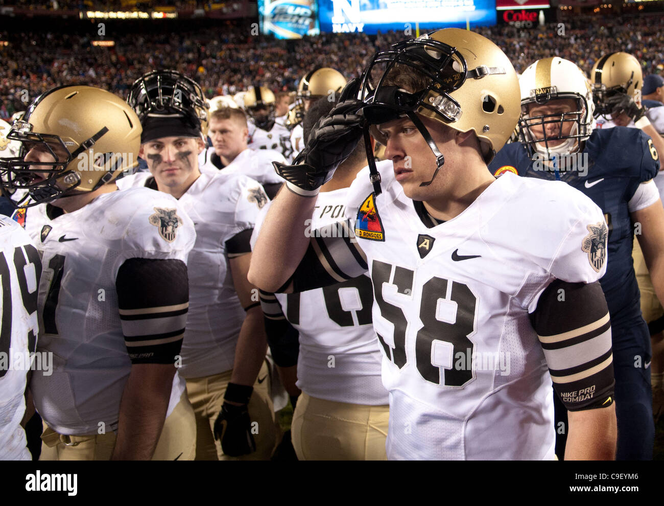 Army's BEN JEBB (#58) walks off the field with his Black Knight ...