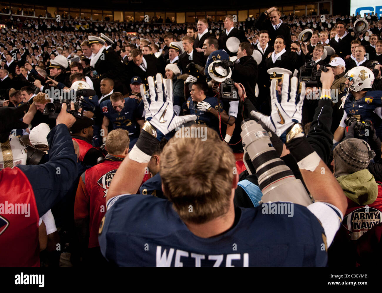Navy's KEEGAN WETZEL holds up both hands signifying 10 consecutive wins ...