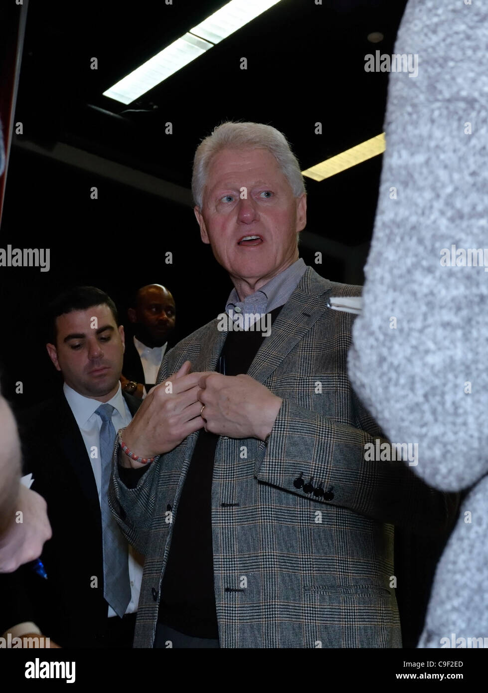 President Bill Clinton speaks with members of the press during the ...
