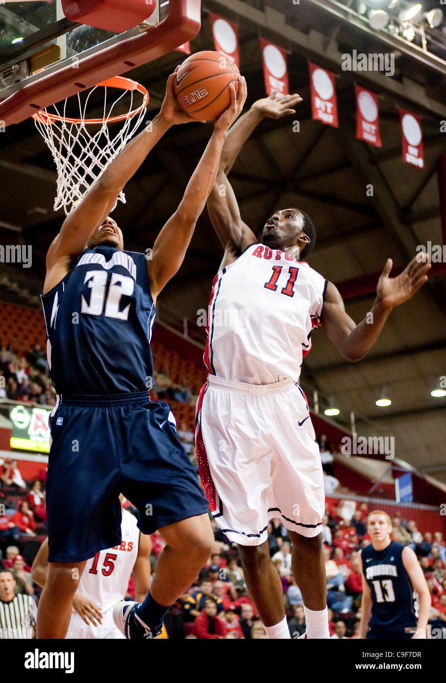 December 12 2011: Rutgers' forward Dane Miller (11) blocks Monmouth's ...