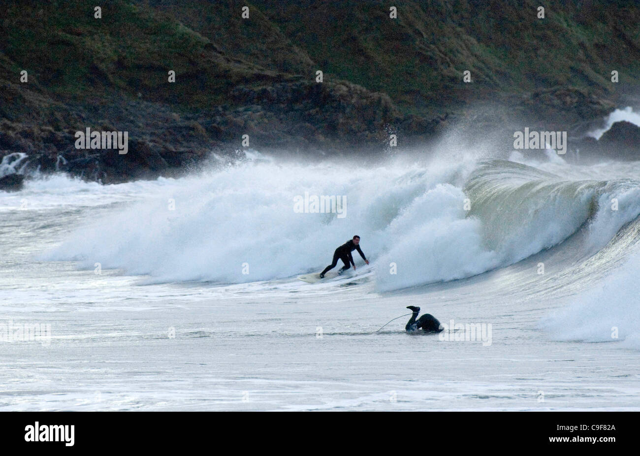 13th Dec 2011 - Swansea, UK - Surfers making the most of the heavy surf ...