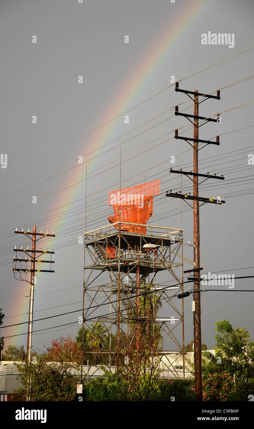 A rainbow forms by the Burbank airport radar as the sun breaks through ...