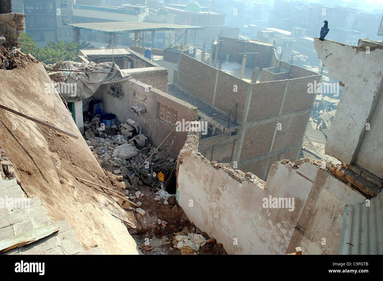 A view of a damaged portion of a building which roof was collapsed due ...