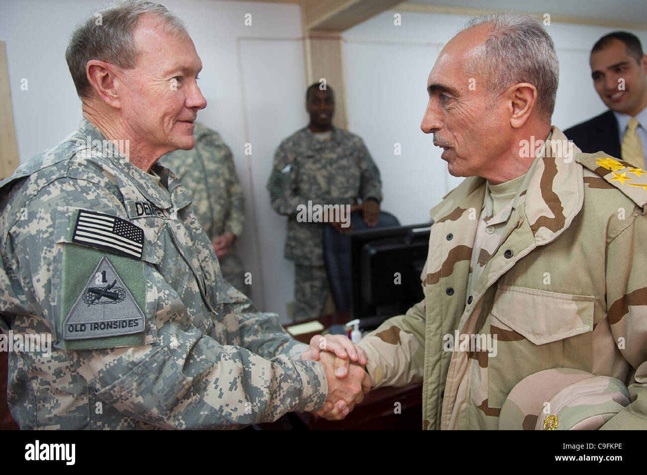 Iraqi Gen. Babikir Zebari shakes hands with US Army Gen. Martin E ...