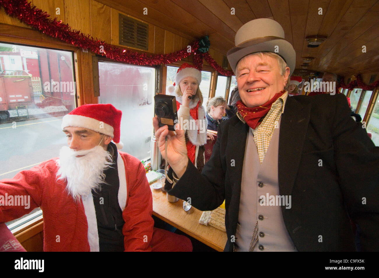 Santa and his elves entertain and give out presents to children aboard ...