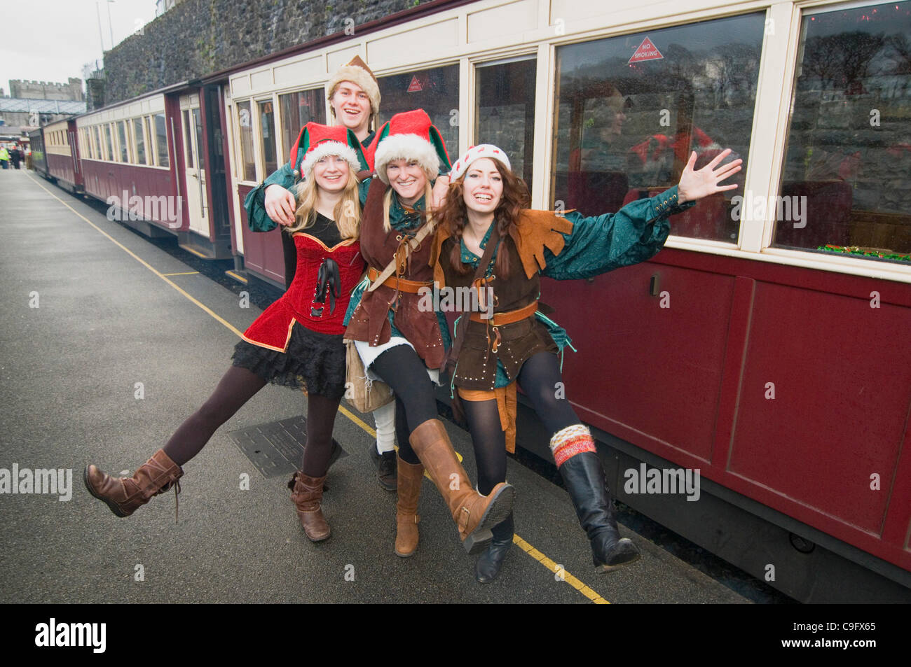 Santa and his elves entertain and give out presents to children aboard ...