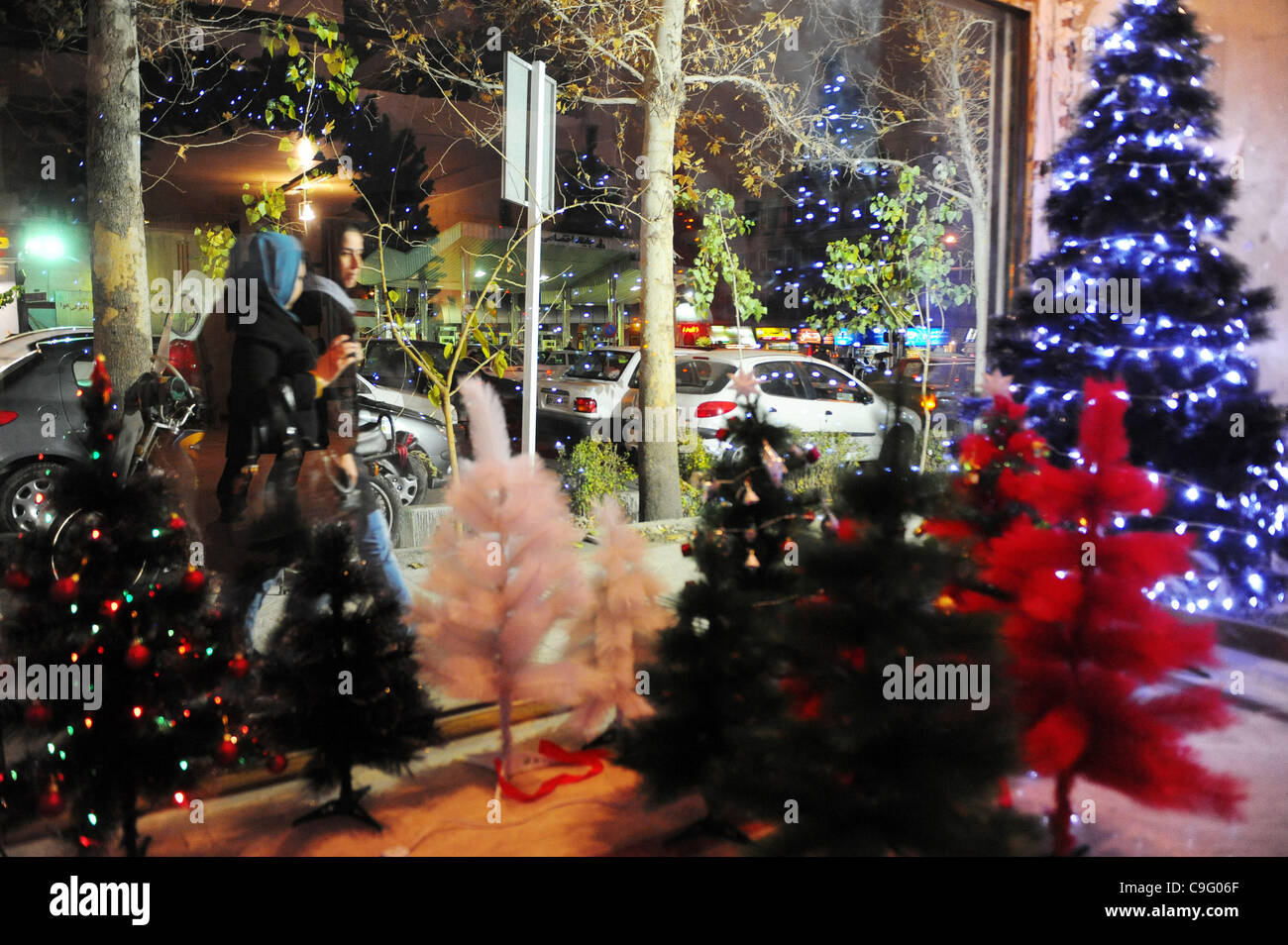 Iranian woman passes a Christmas gift shop in Tehran, Iran on December ...