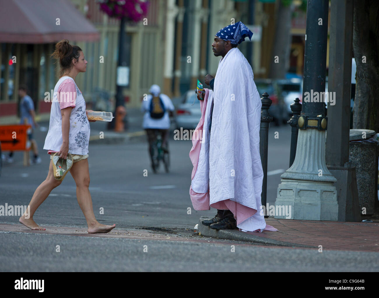 Aug. 5, 2011 - Portland, Oregon, U.S - A homeless man wrapped in a ...
