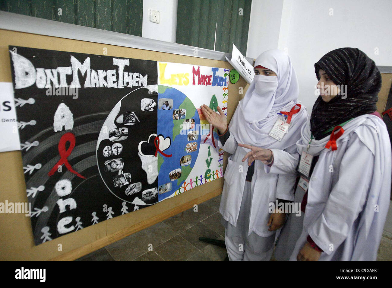 Students look a chart during a program about aids hi-res stock ...