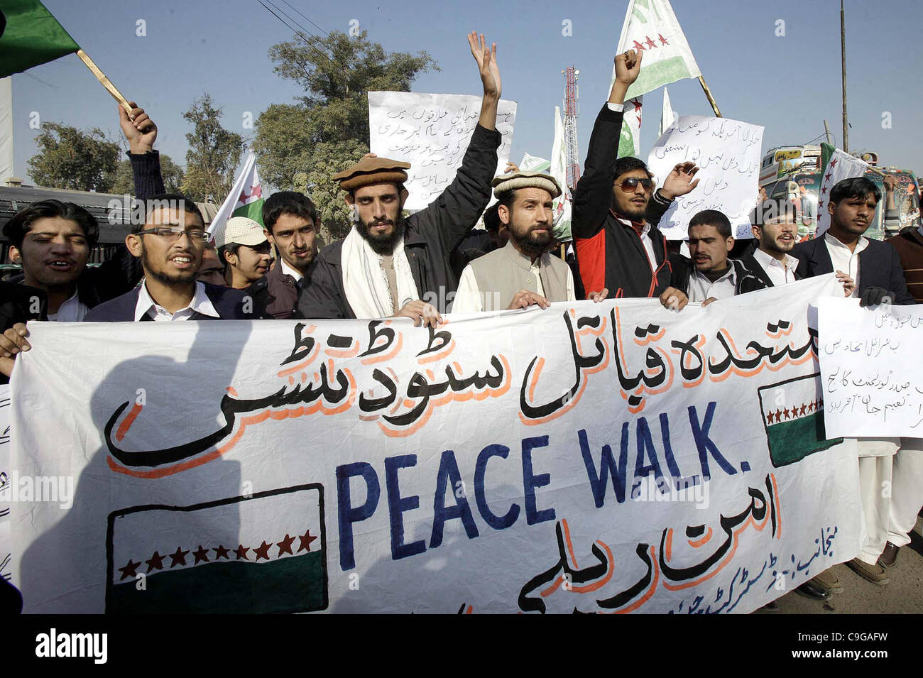 Students chant slogans during peace walk arranged by Muttehda Qabail ...
